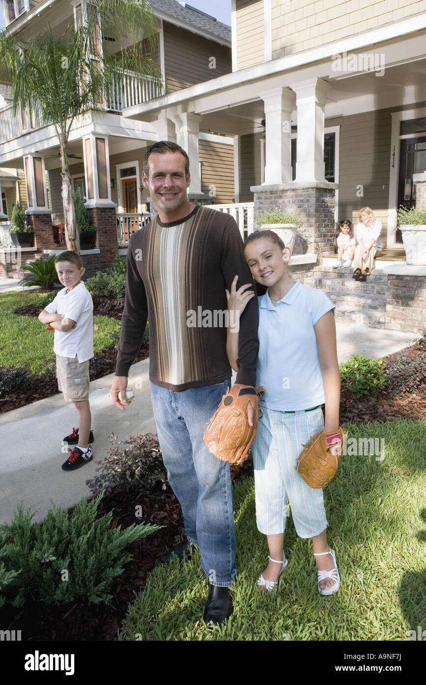 Portrait of a family in front of their house Stock Photo - Alamy