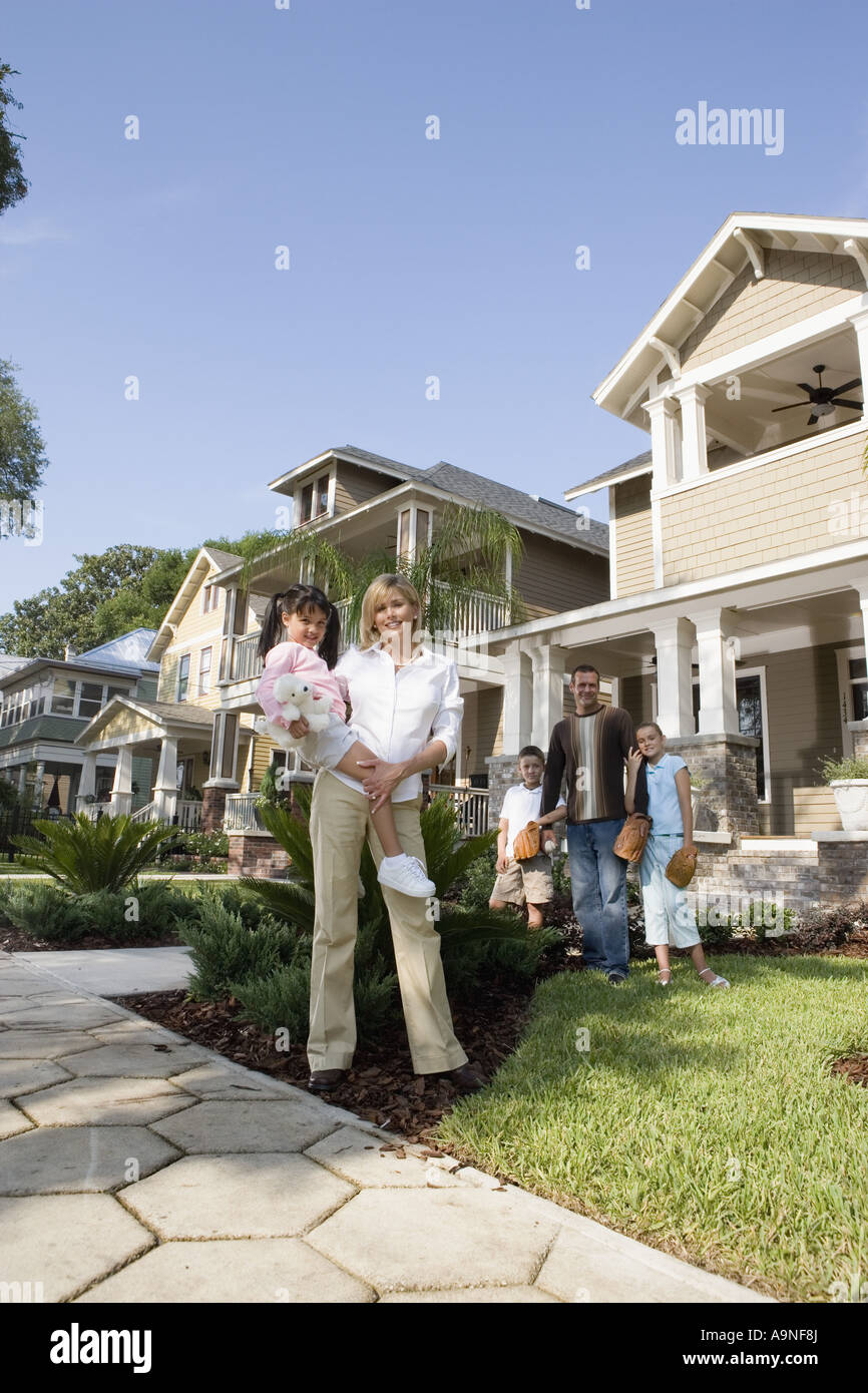 Portrait of a family in front of their house Stock Photo - Alamy