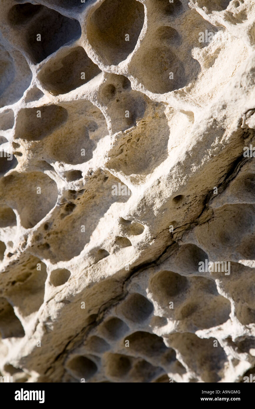 A honeycombed pattern eroded by weather in sedimentary rock on Elgol ...