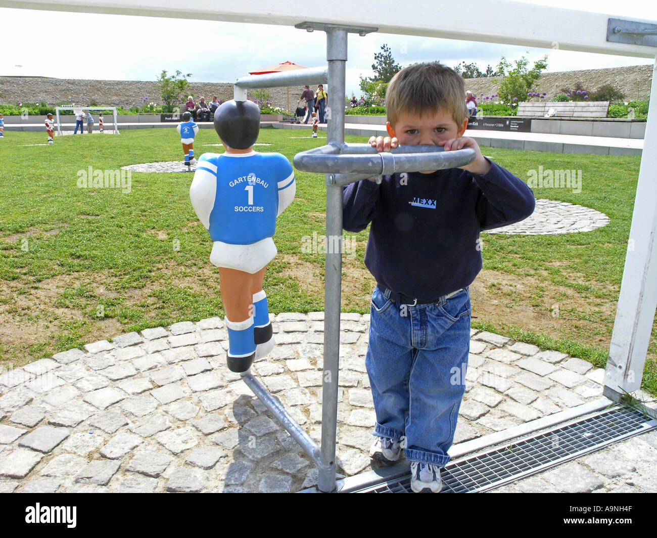 Human figure soccer player in park in Munich Germany Stock Photo - Alamy