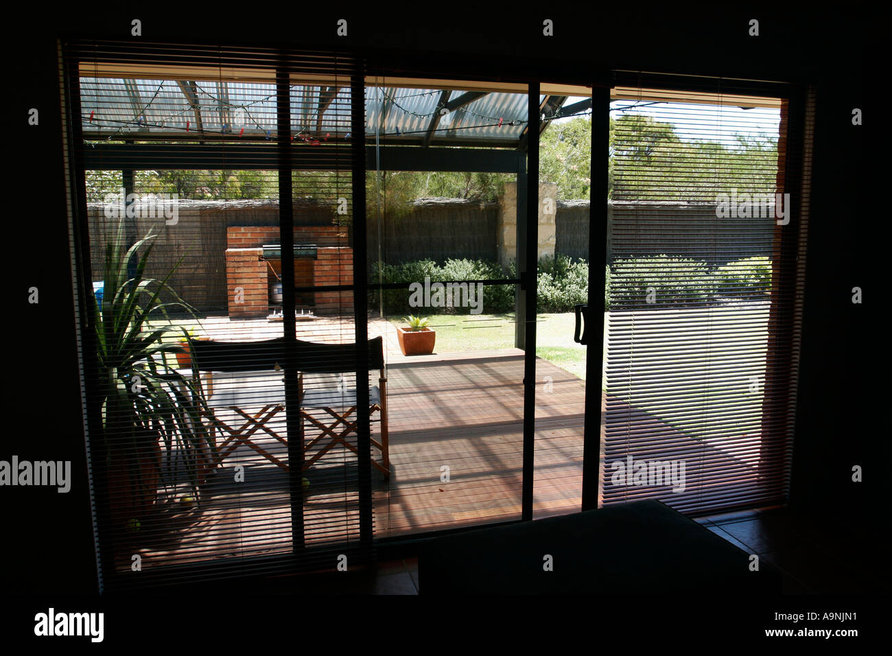 French windows looking out over a shaded patio Stock Photo - Alamy