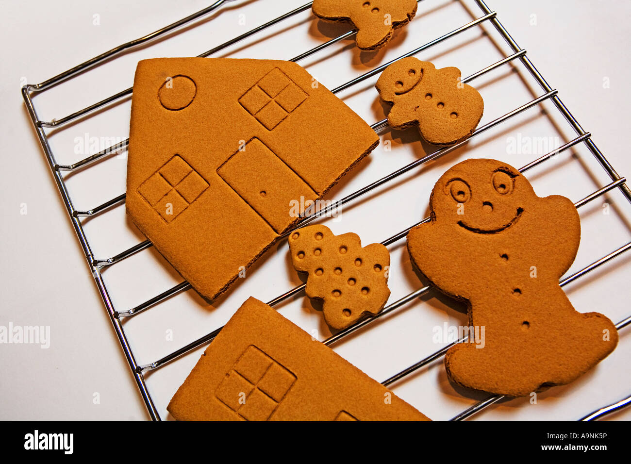 Image of several parts to a gingerbread house fresh out of the oven and ...