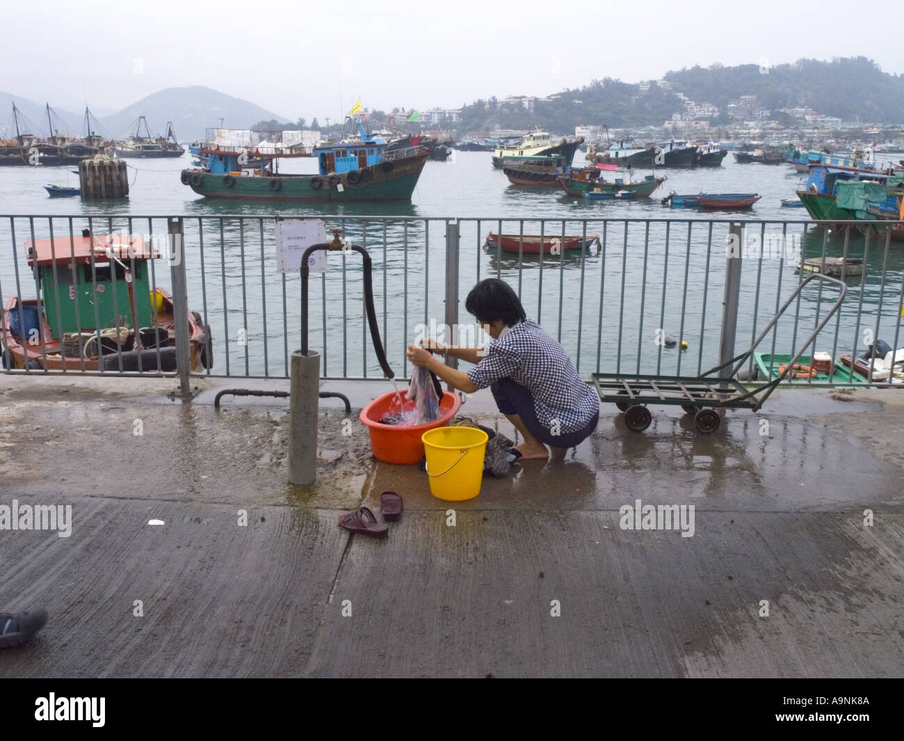 Woman wash clothes Cheung chau Hong kong china chinese asia asian Stock ...