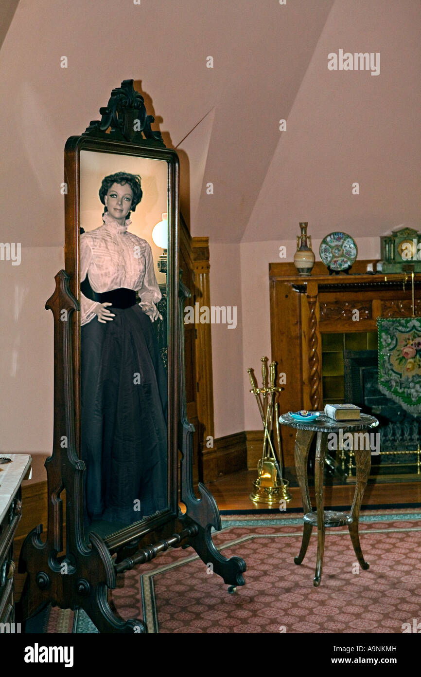 Image of the interior of the bedroom with a woman s reflection in a ...