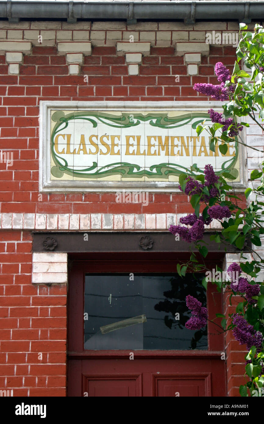 Tiled sign above door to old country school building Art Nouveau Stock ...