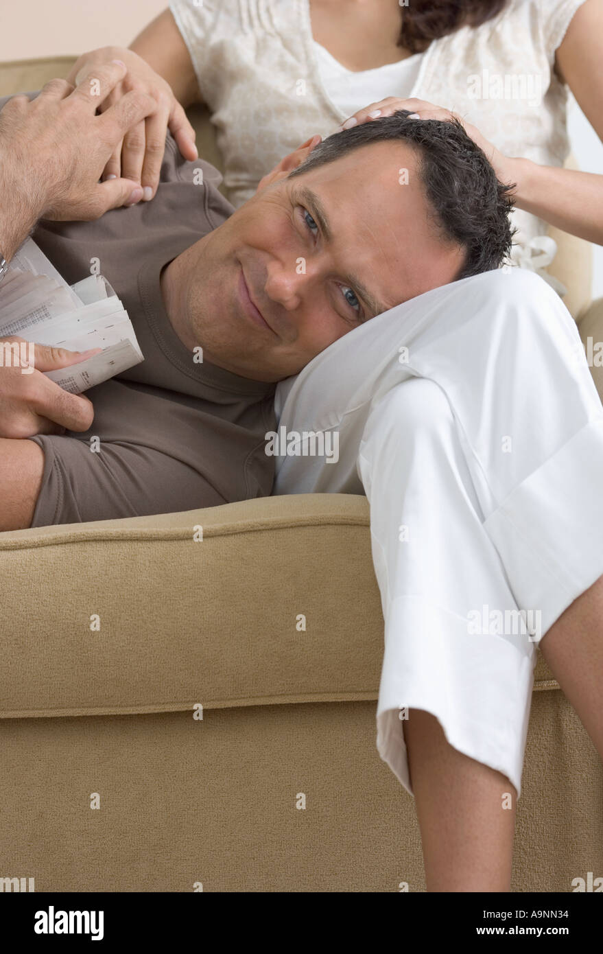 Man resting head on woman s lap Stock Photo - Alamy