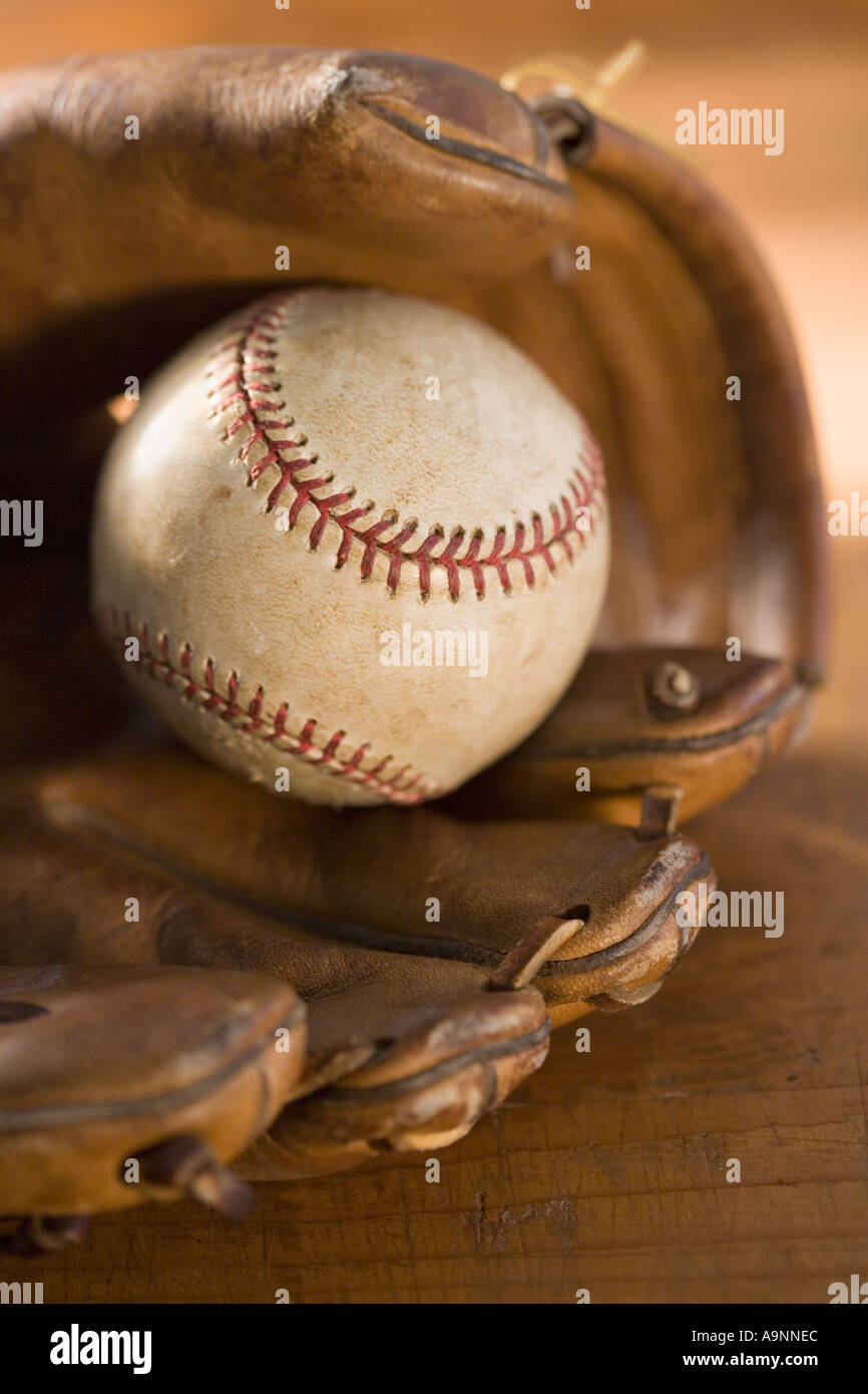 Still life of a baseball glove and ball Stock Photo - Alamy