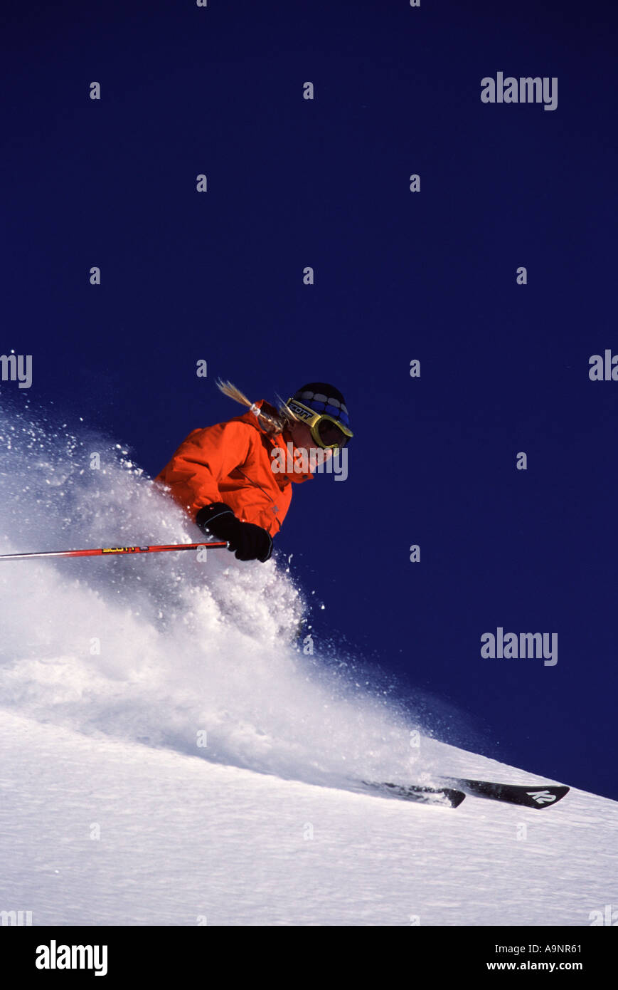 A woman skiing powder at Alpine Meadows CA Stock Photo - Alamy