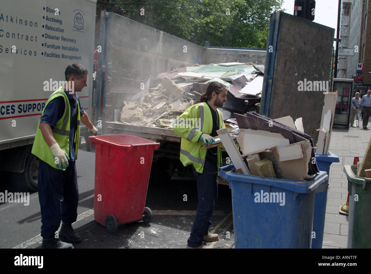 Workers clean rubble hi-res stock photography and images - Alamy