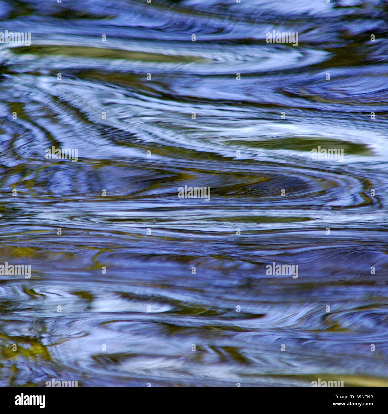 Close up abstract study of ripples on a lake frozen in time and ...