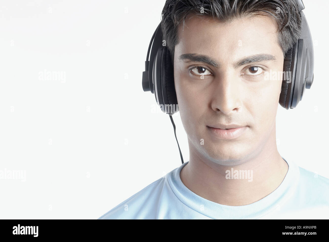 Portrait of a young man wearing headphones Stock Photo - Alamy