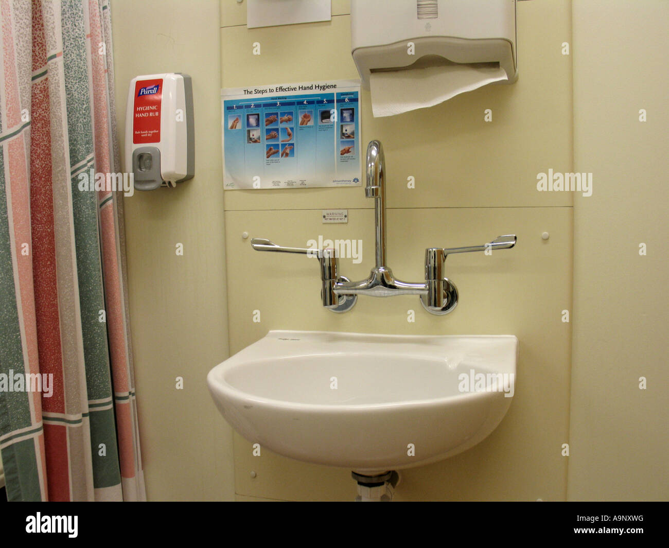 hand washing station on hospital ward with antiseptic gel dispenser ...