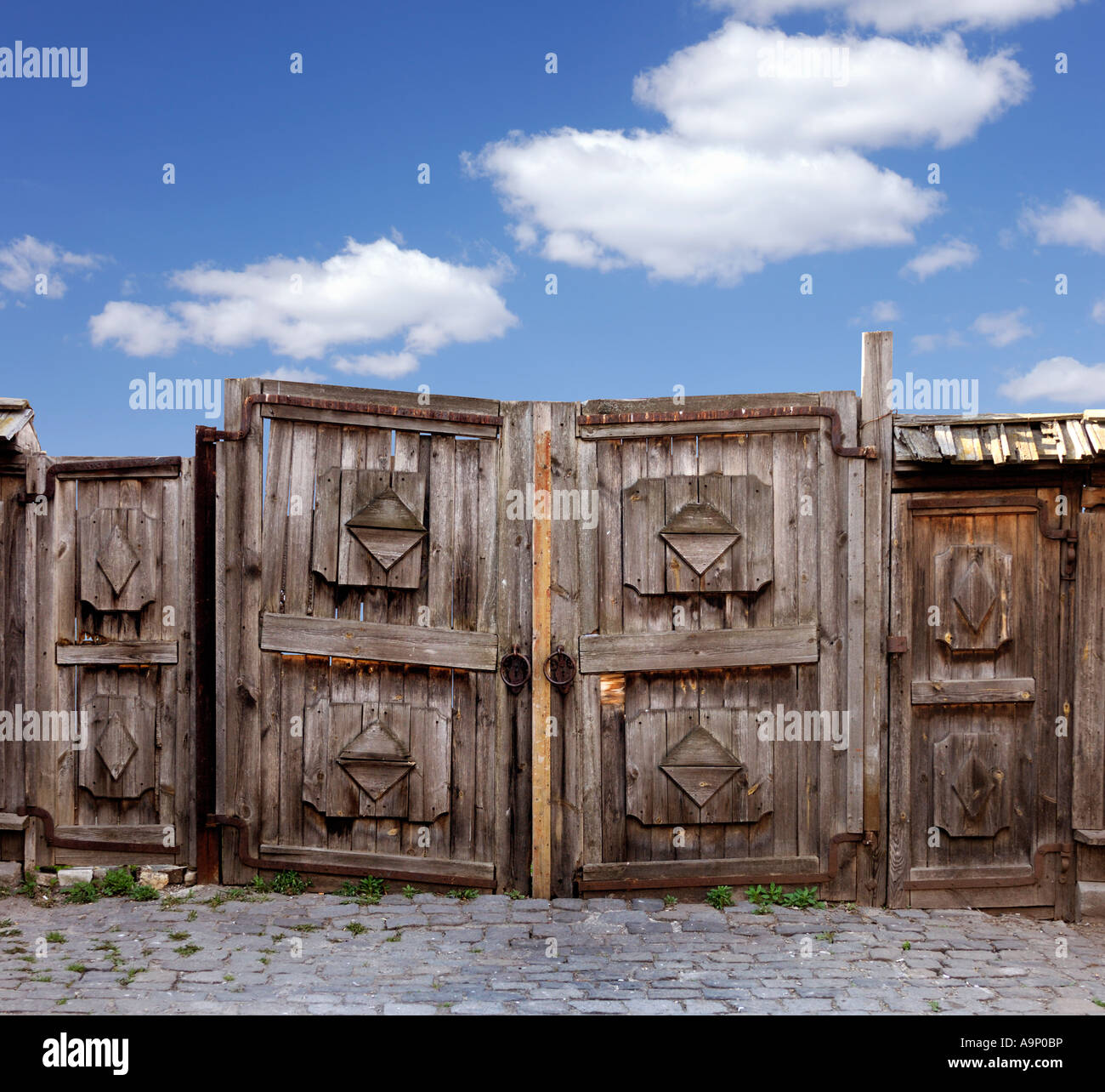 Old wooden closed gates in a fence Stock Photo - Alamy