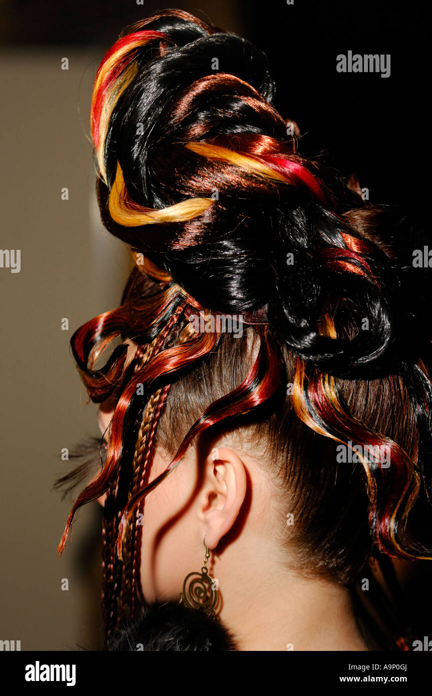Woman with creative hair style and colorful dyed locks in braids ...