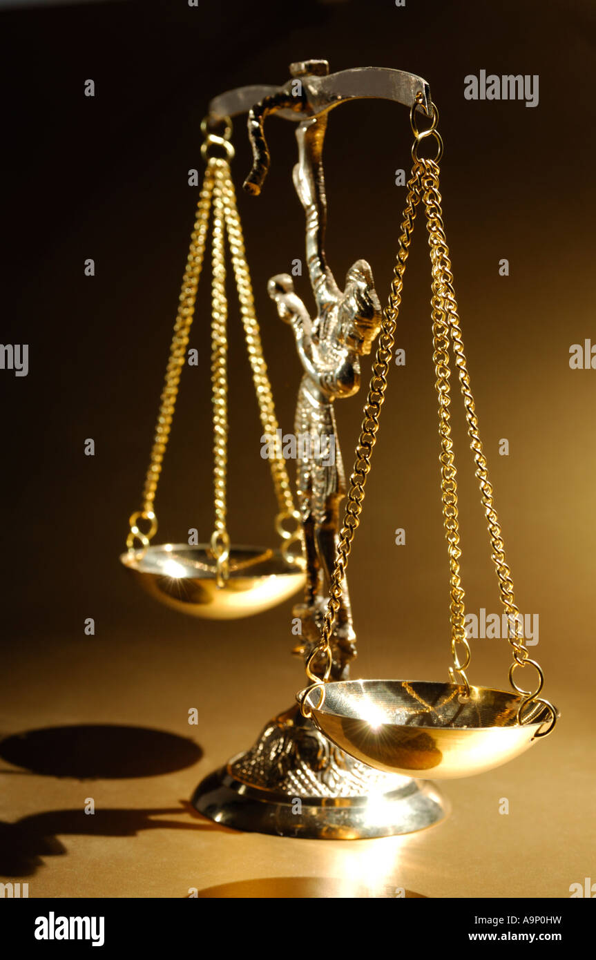 Balanced golden decorative justice scales Stock Photo - Alamy