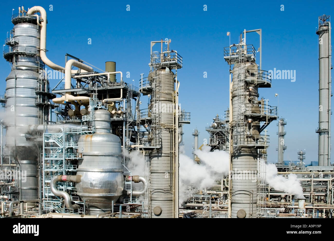 The complex working systems of an oil refinery in operation Stock Photo ...