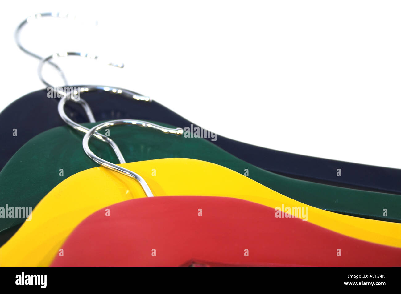 Colorful clothes hangers isolated on white Stock Photo - Alamy