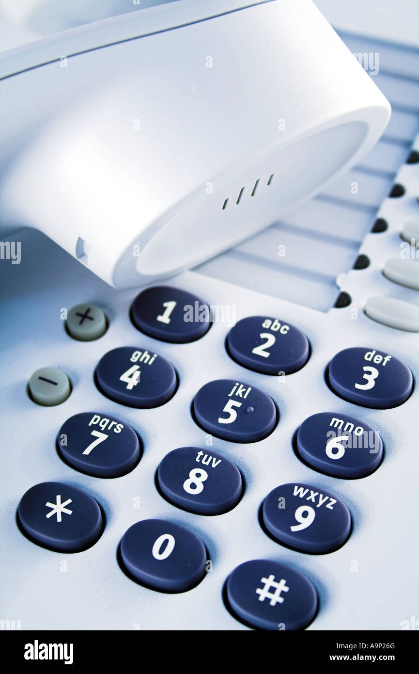 Office telephone. Detail of earpiece and keypad Stock Photo - Alamy