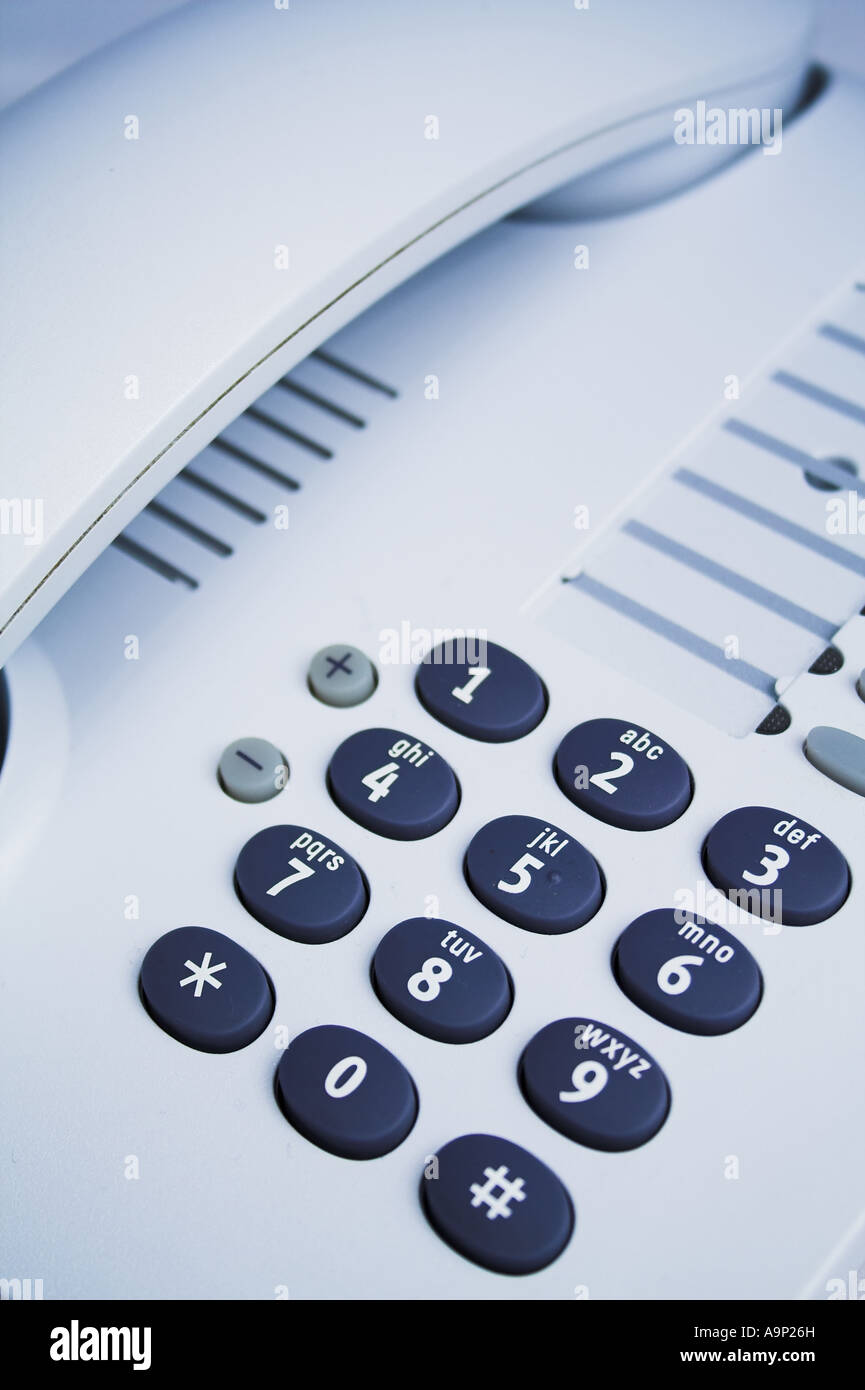 Office telephone. Detail of earpiece and keypad Stock Photo - Alamy