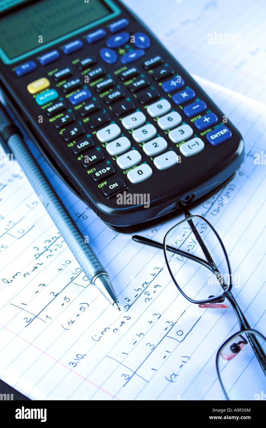 Scientific Calculator with exercise book and glasses Stock Photo - Alamy