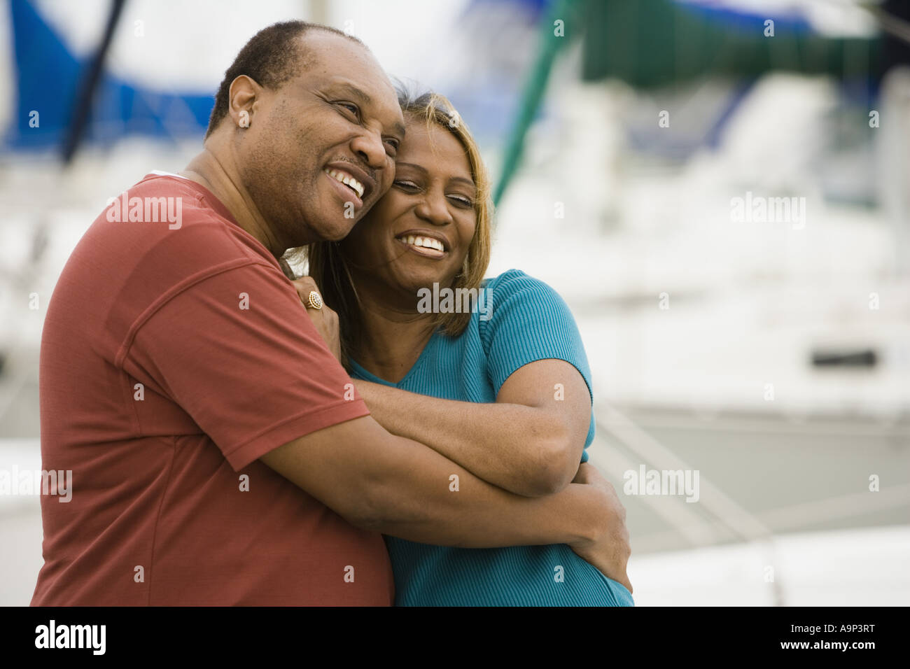 Mature African American couple embracing Stock Photo - Alamy