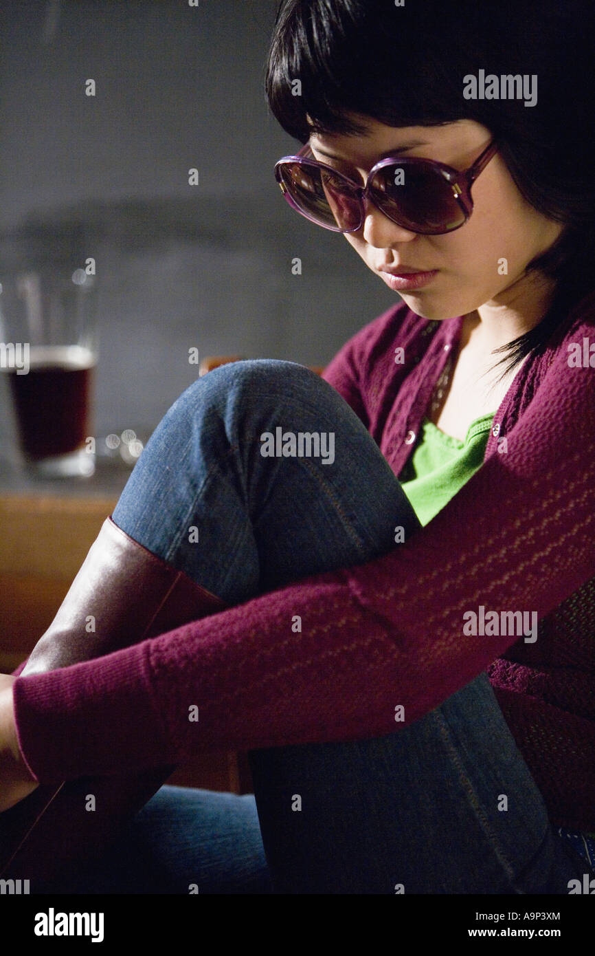 View of a contemplative young Asian woman Stock Photo - Alamy