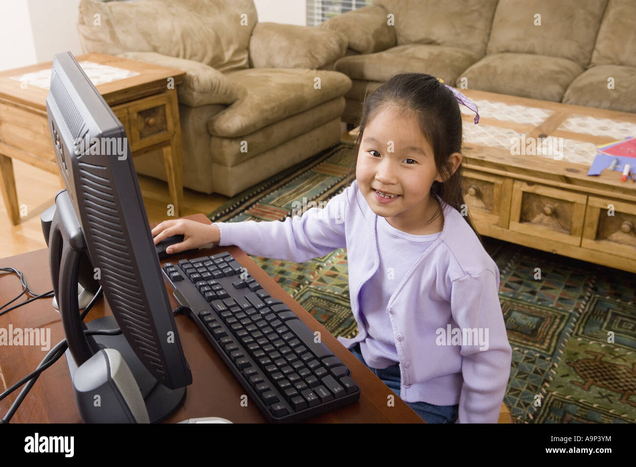 Portrait of a young Asian girl using computer Stock Photo - Alamy
