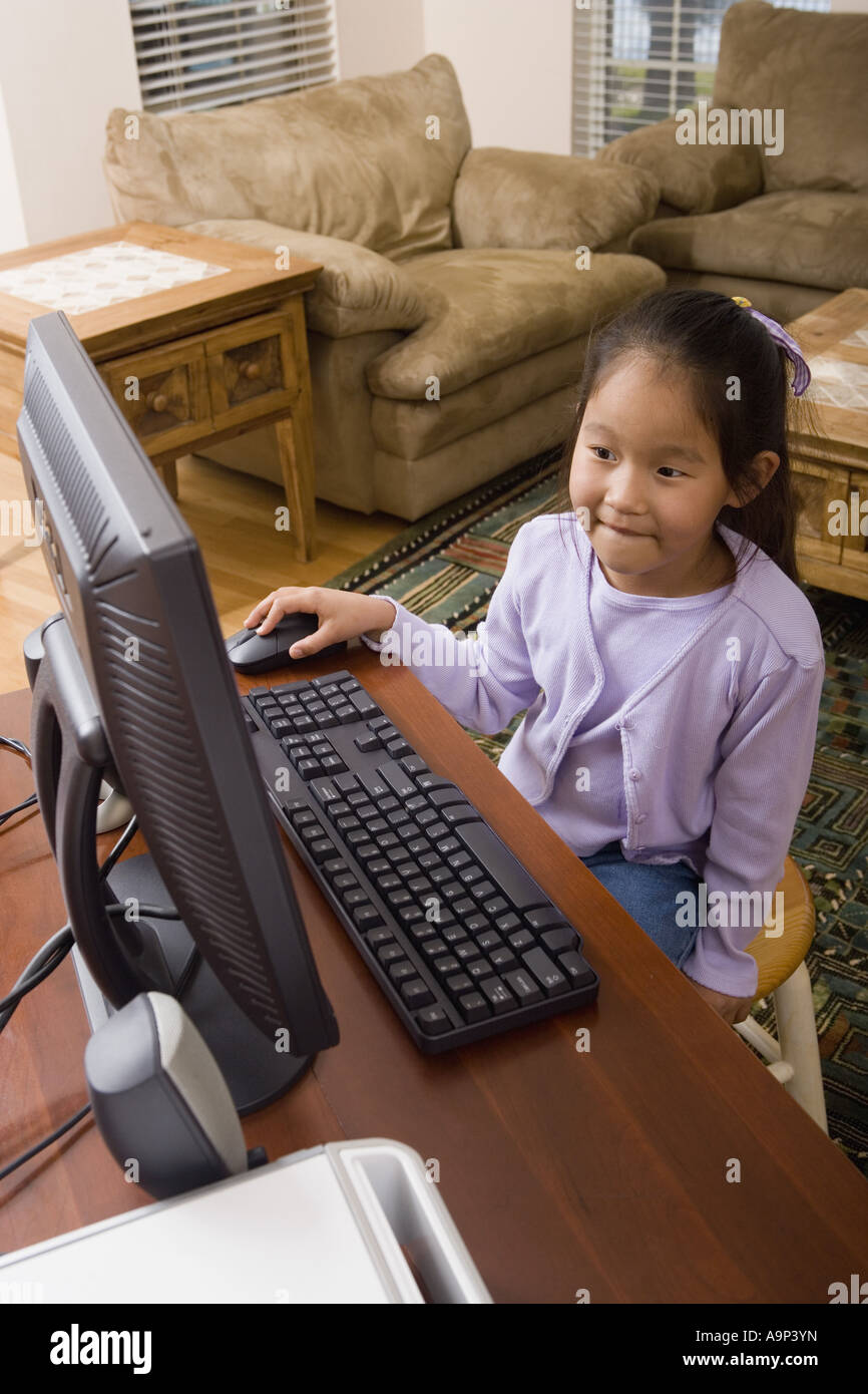 Young Asian girl using computer Stock Photo - Alamy