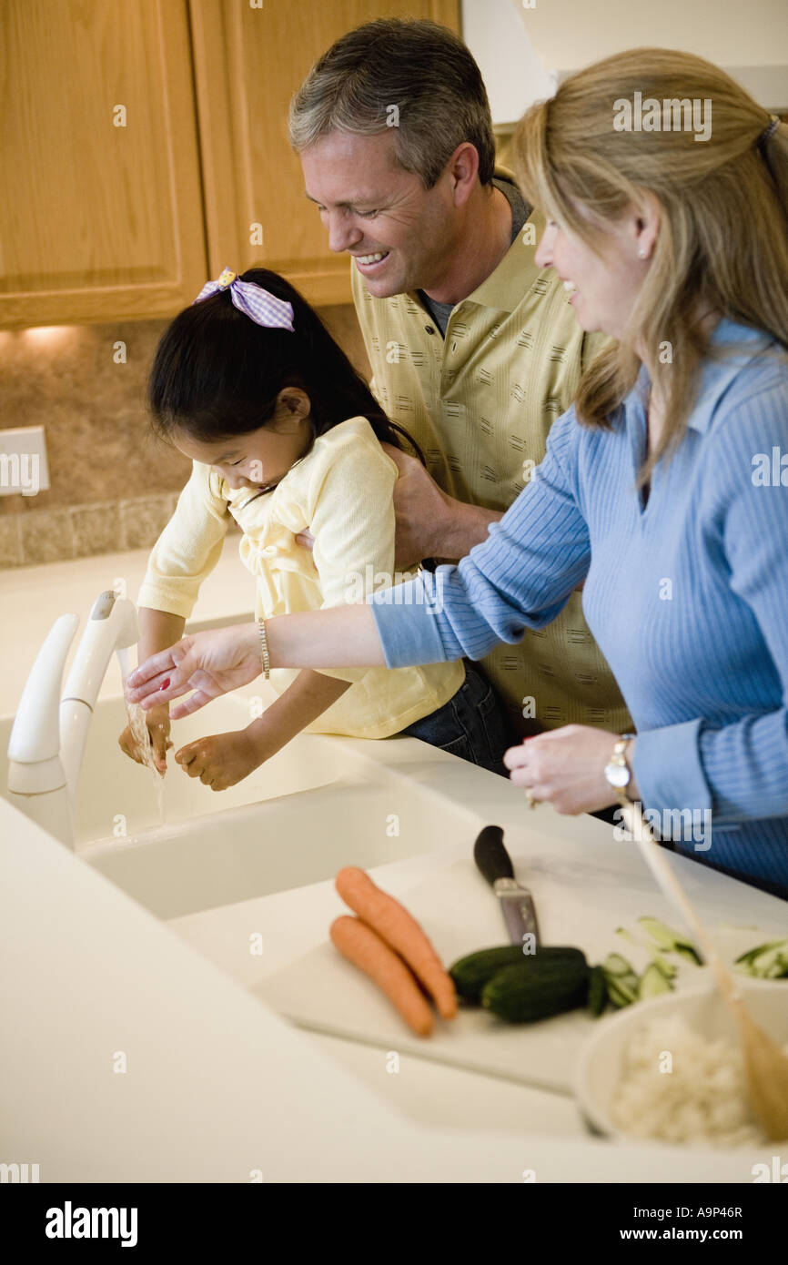 Child washing hands ethnic hi-res stock photography and images - Alamy