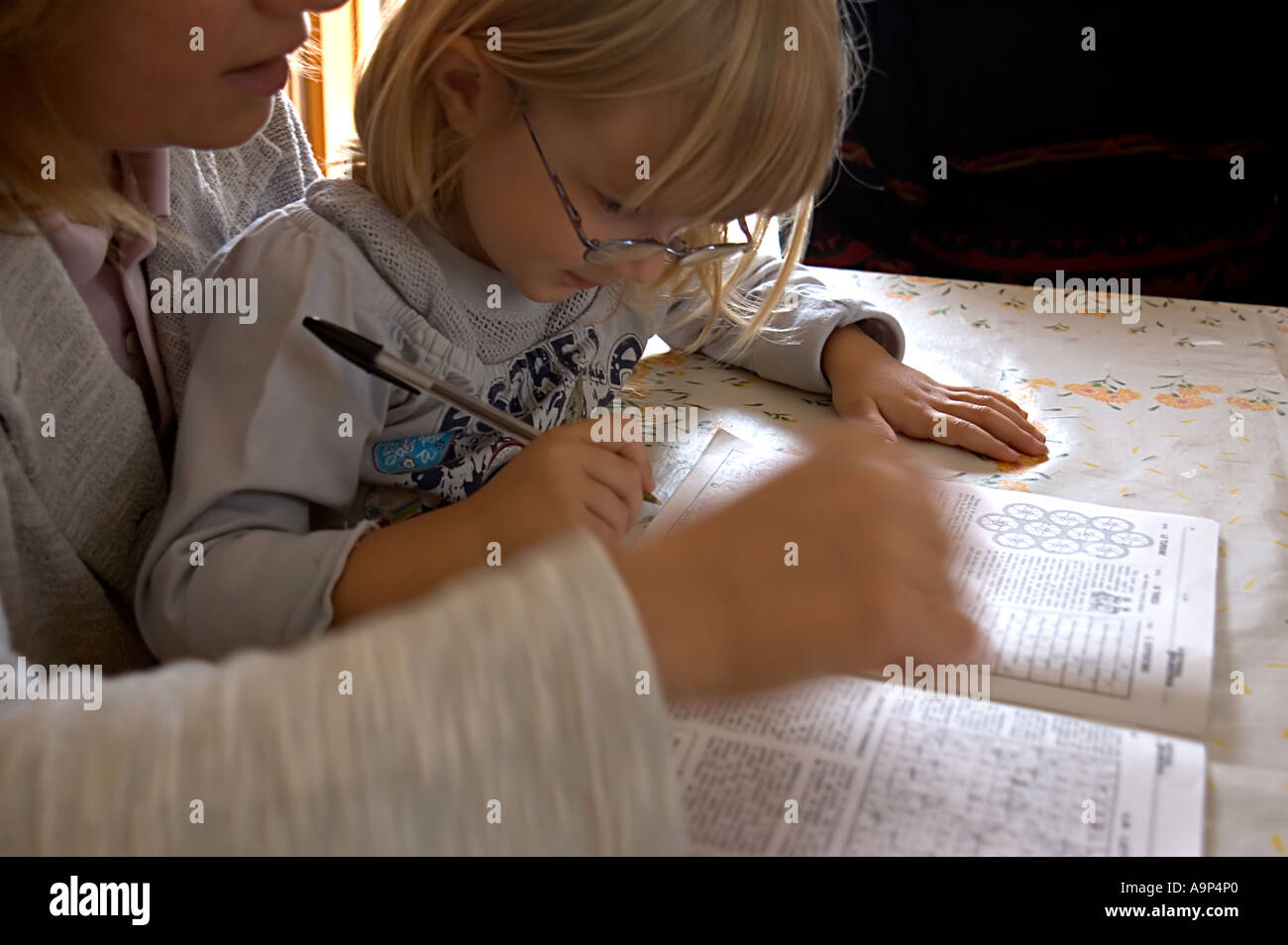girl with mom learn to write Stock Photo - Alamy