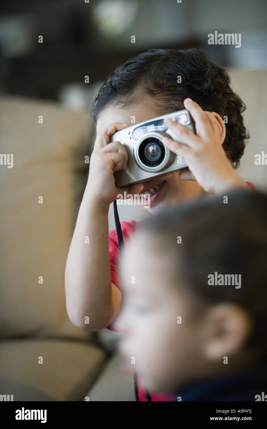Little boy holding a camera Stock Photo - Alamy