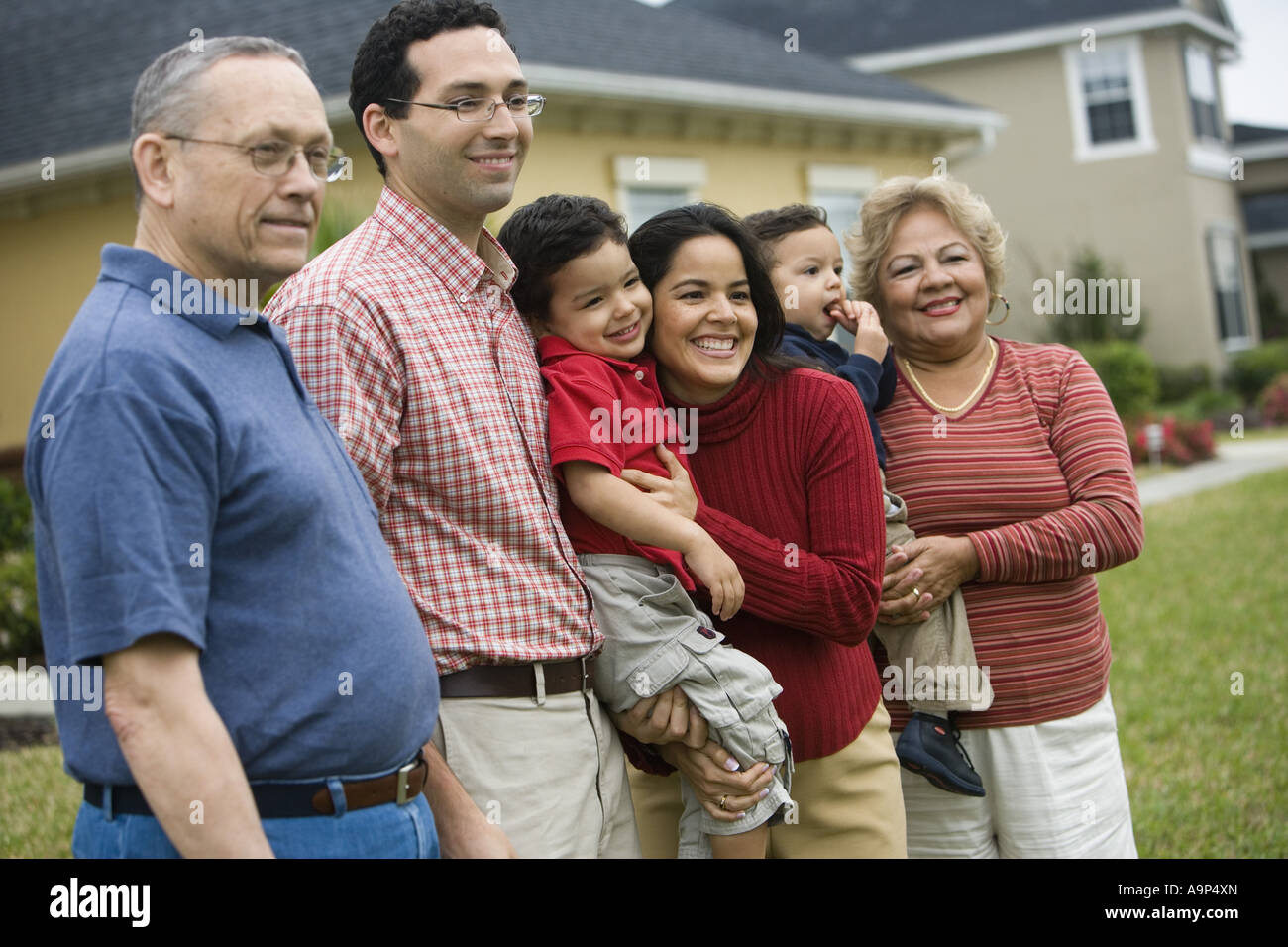 A 3 generation Hispanic family posing in backyard Stock Photo - Alamy