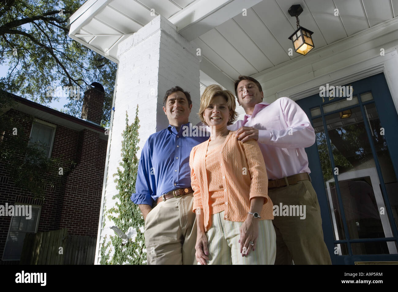 Portrait of a family standing outside a house Stock Photo - Alamy
