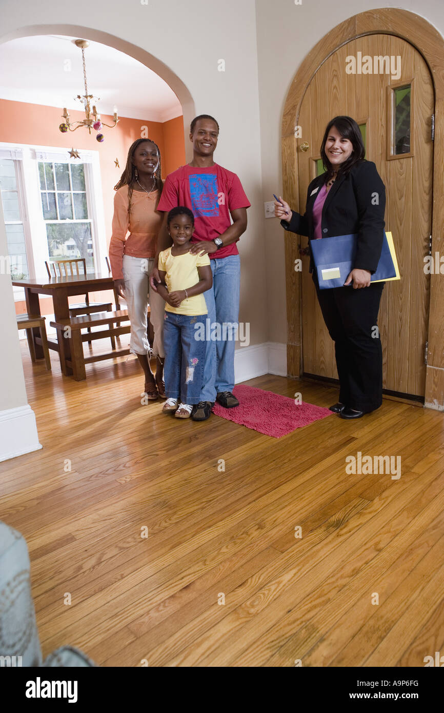 Portrait of family inside house with real estate broker Stock Photo - Alamy