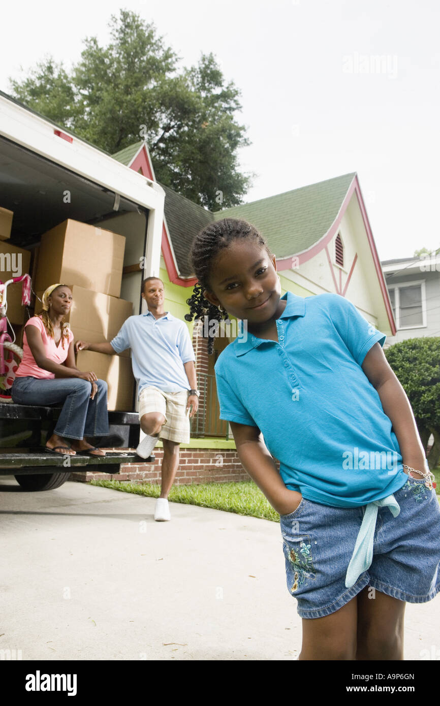 Portrait of a family standing outside a house by moving truck Stock ...