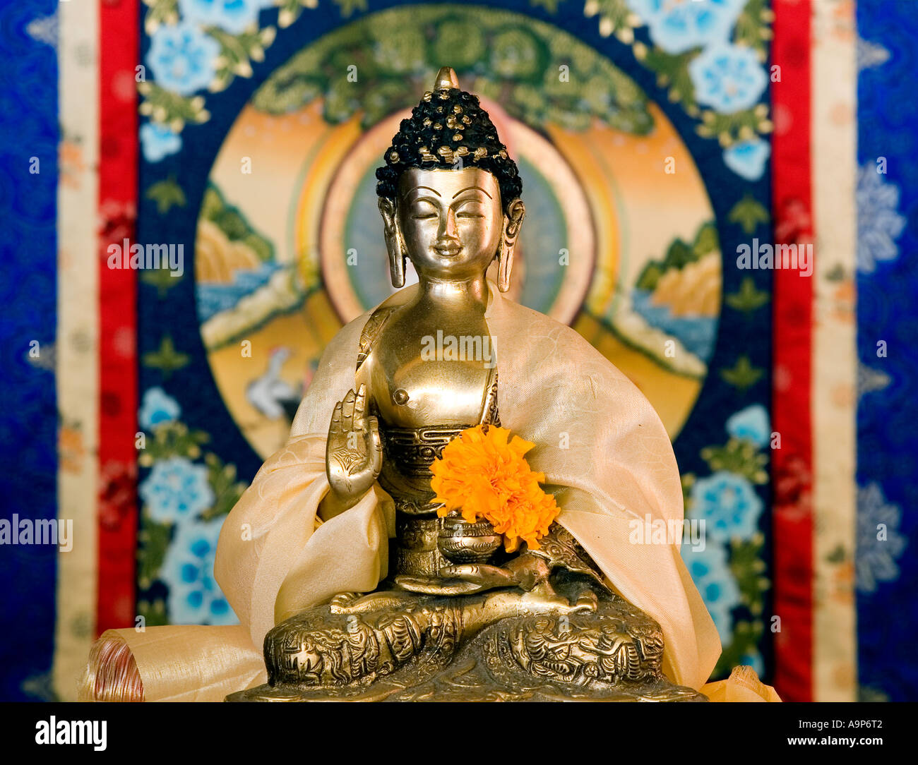 Buddha altar in front of tanka painting Stock Photo - Alamy