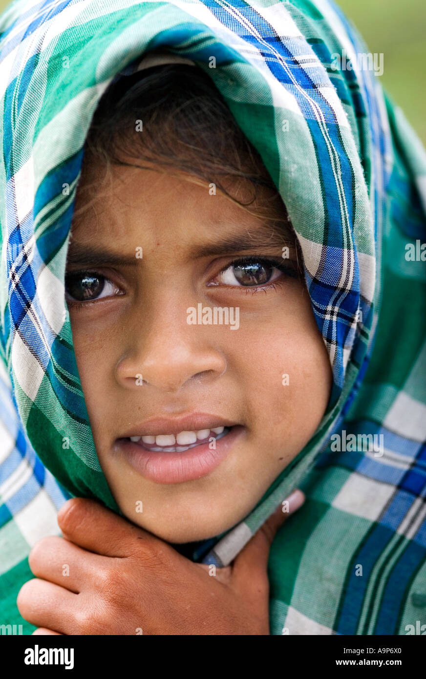 Young Indian girl with her head covered in a cloth Stock Photo - Alamy