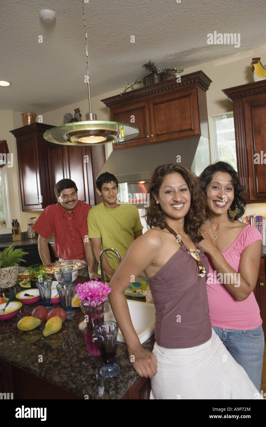 Indian family in kitchen preparing food Stock Photo - Alamy