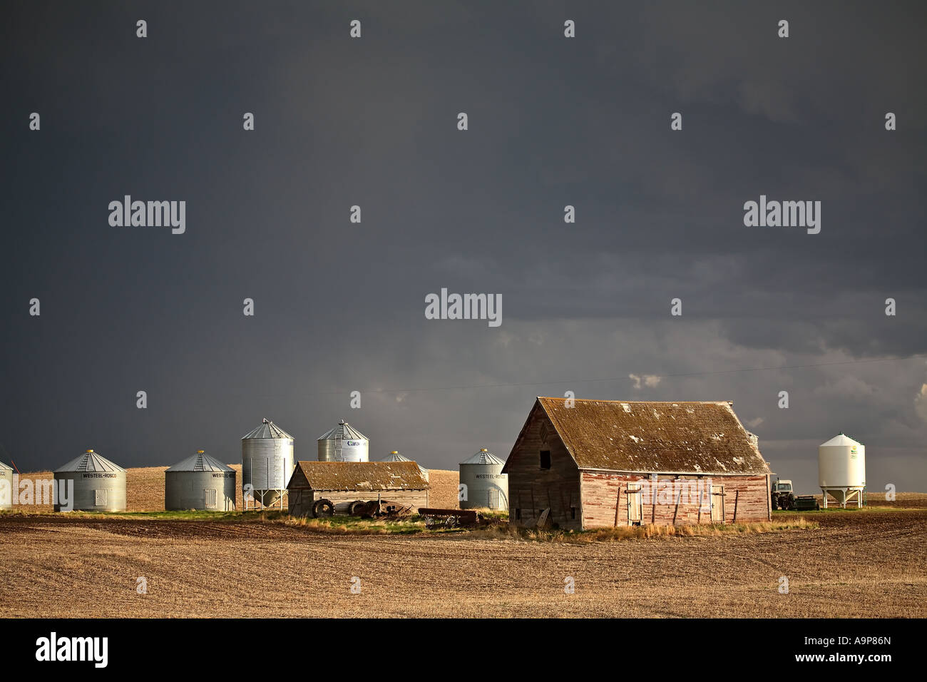 Storm clouds over farm buildings in Saskatchewan Stock Photo - Alamy