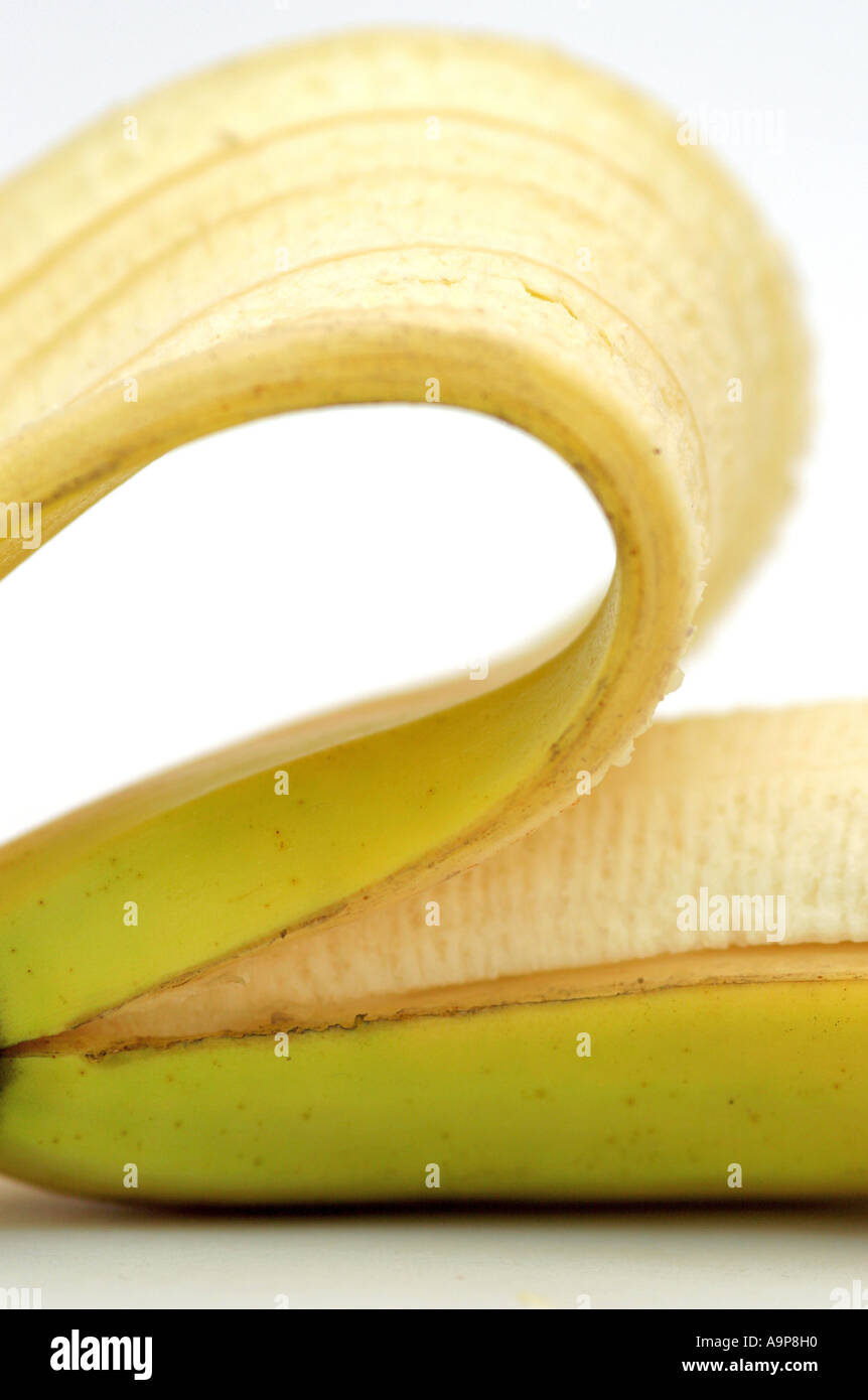 Banana with skin peeled back Stock Photo - Alamy
