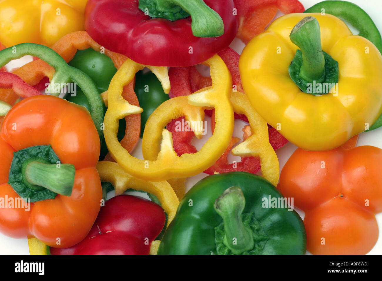 Sliced coloured peppers Stock Photo - Alamy