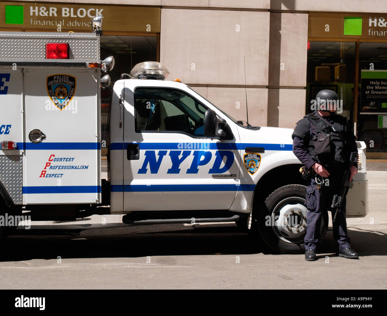 armed NYPD police officer and vehicle outside bank in financial ...