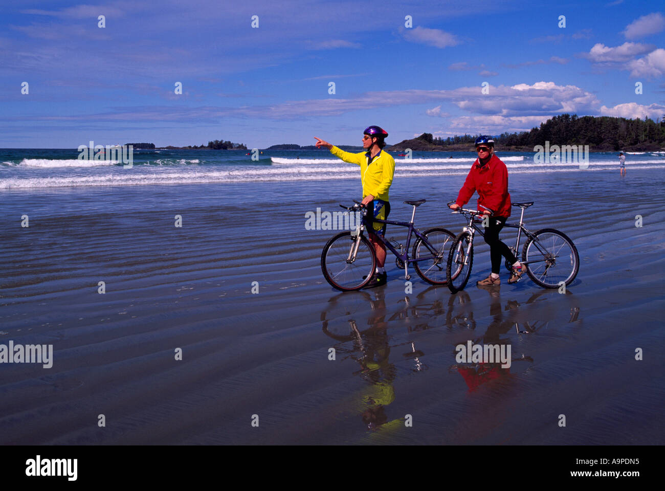 Mountain Bikers biking on Beach in Pacific Rim National Park Reserve ...