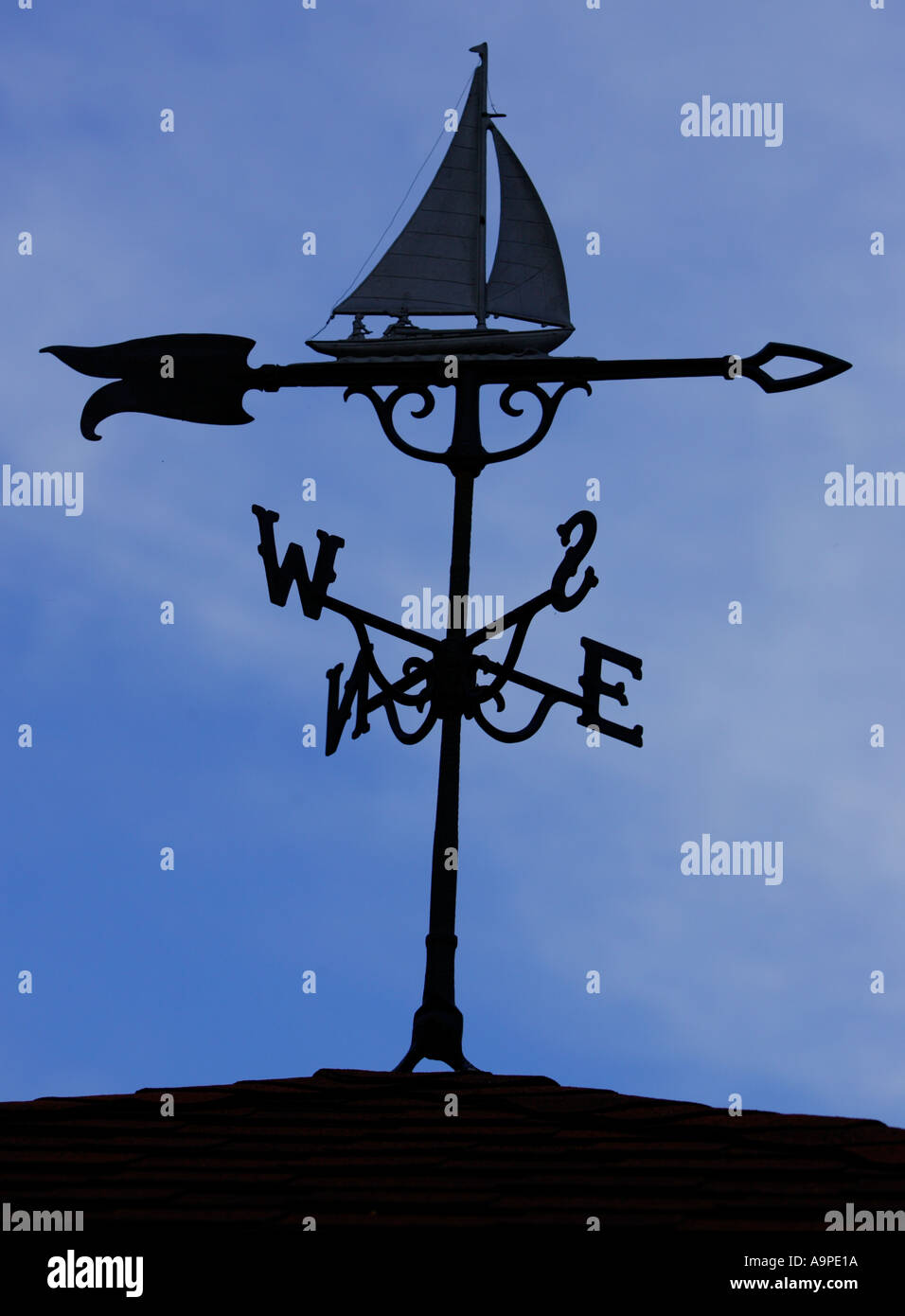 Weather vane on top of a building Stock Photo - Alamy