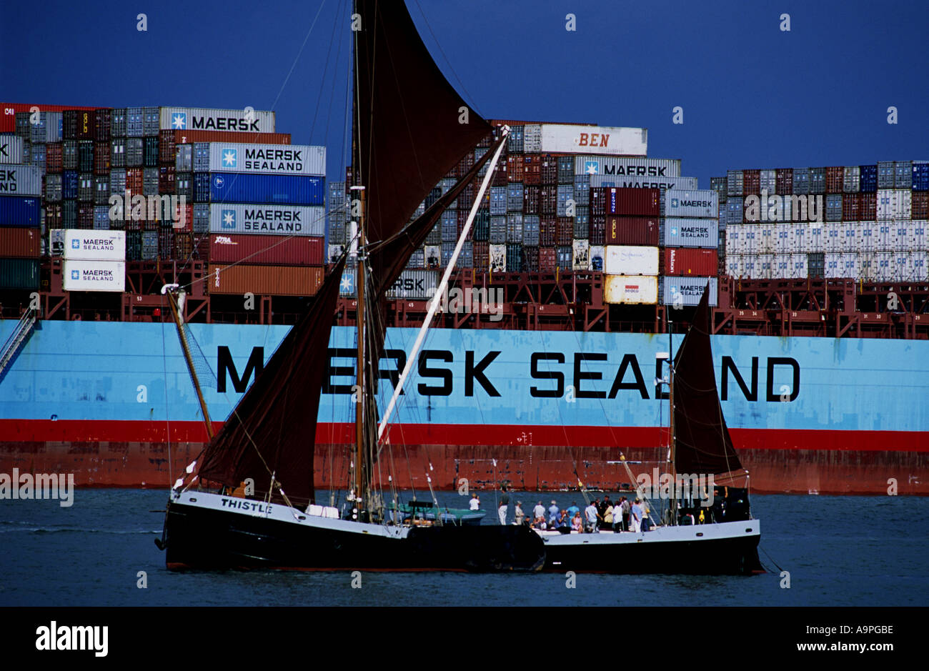 Tourist barge Thistle on the river Orwell passing Maersk Sealand ...