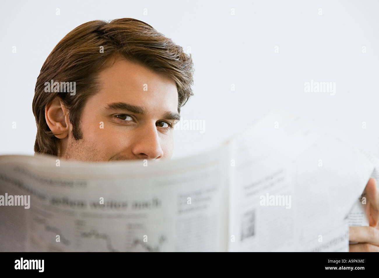Newspaper looking over hi-res stock photography and images - Alamy
