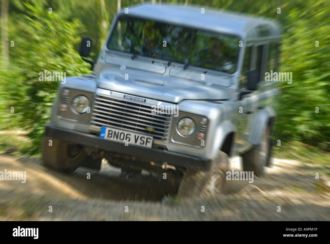 Off roading silver metallic Land Rover Defender 110 TD5 by Land Rover ...