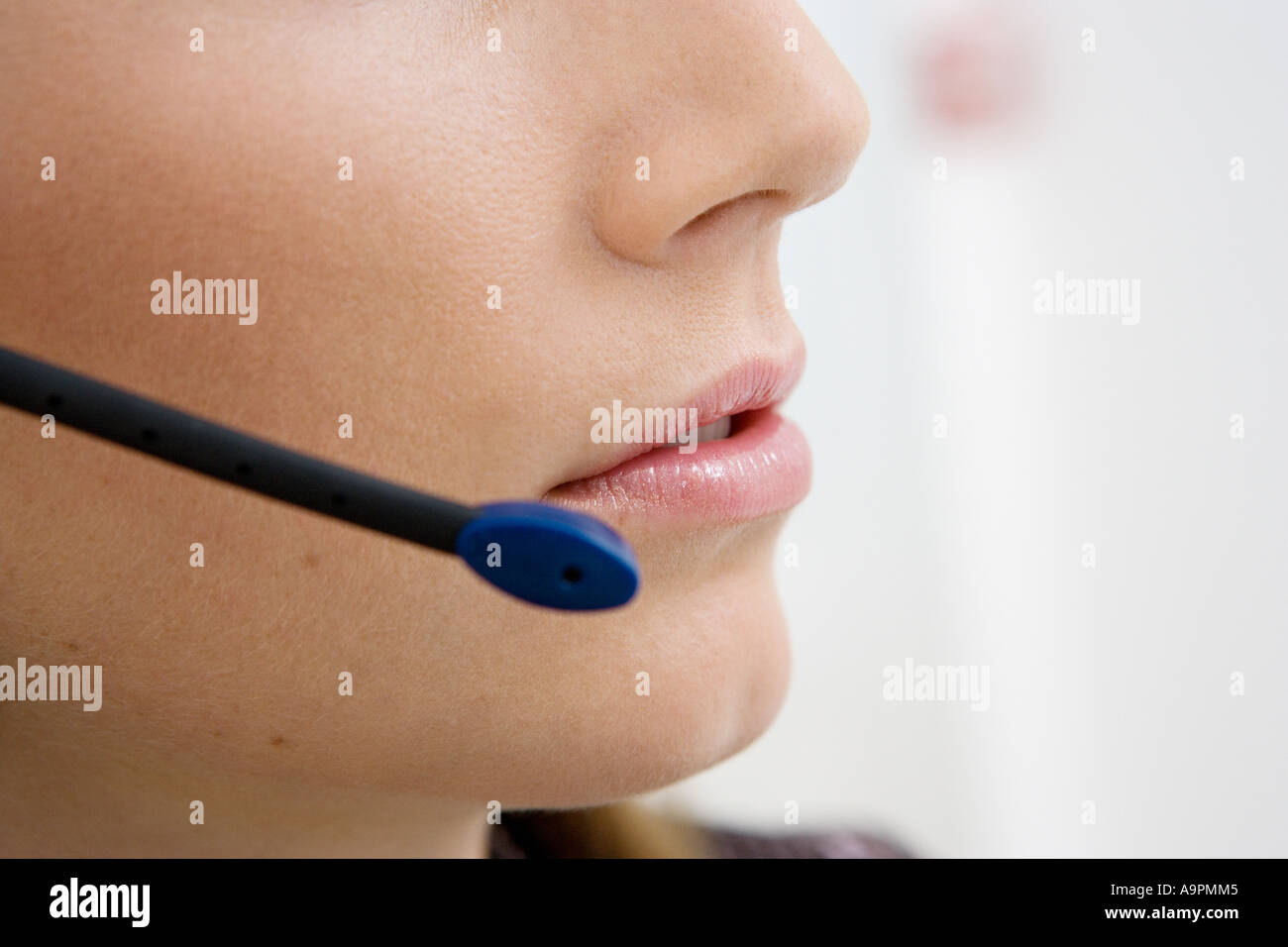 Woman with headset microphone Stock Photo - Alamy