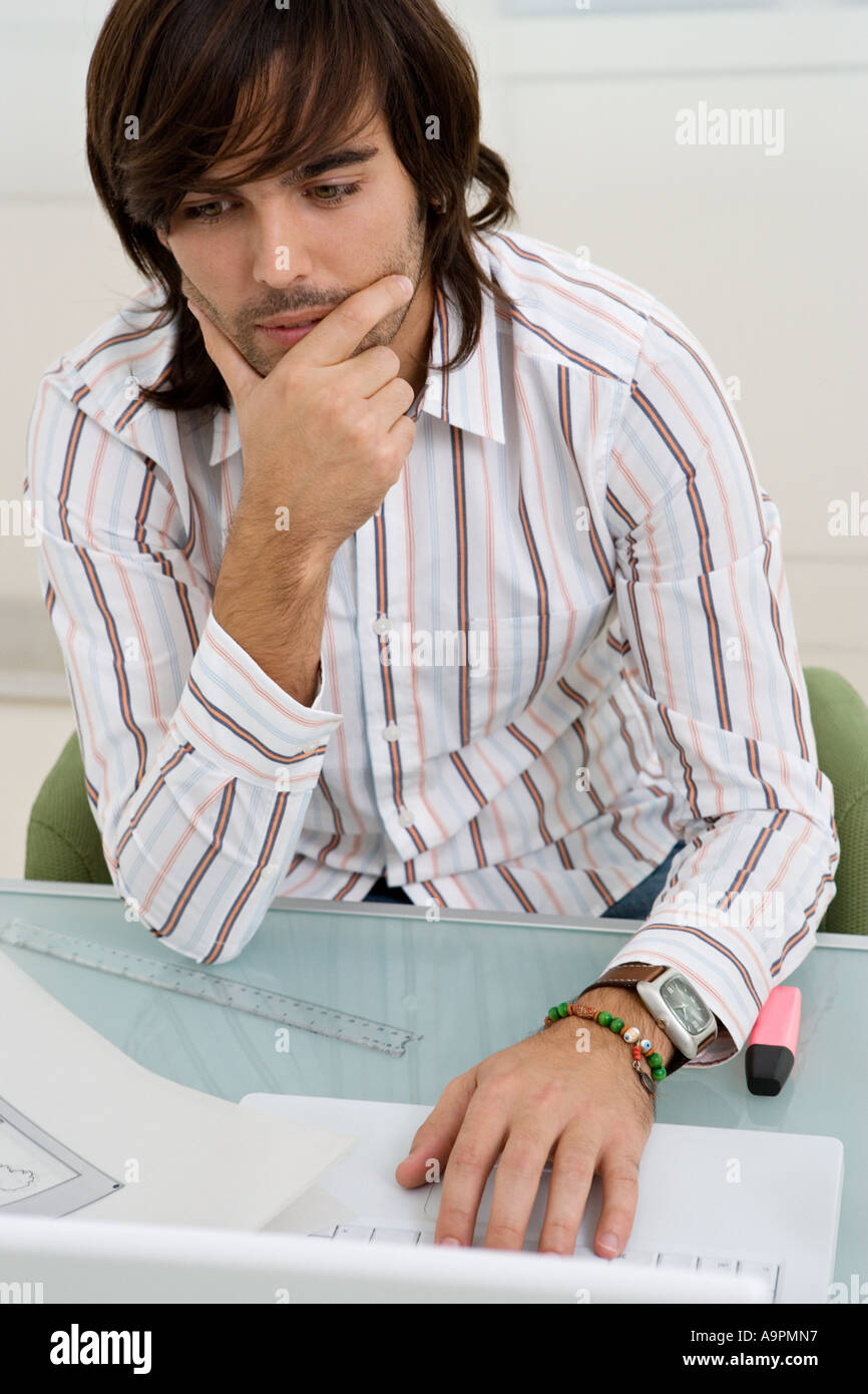 Young man thinking Stock Photo - Alamy