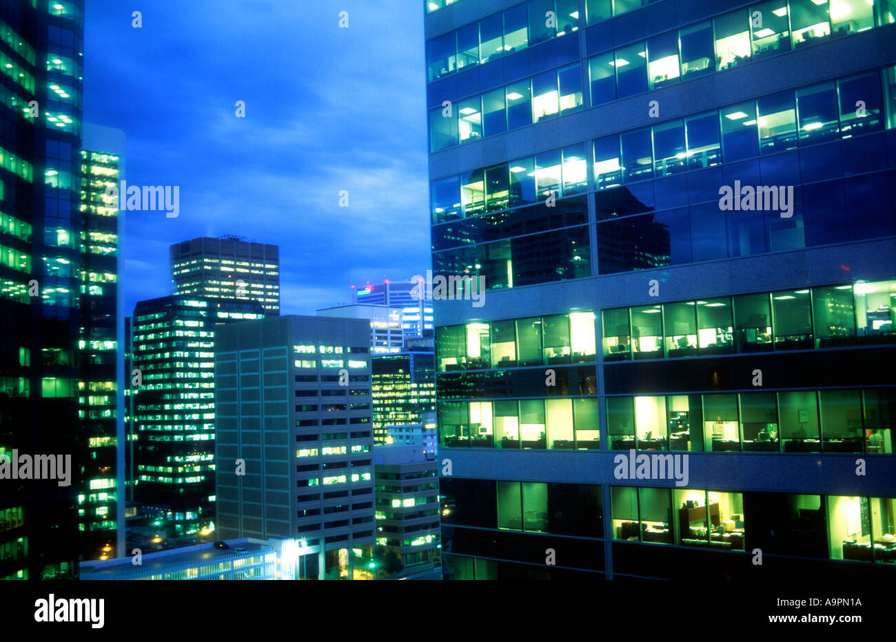 Canada Alberta Calgary office towers illuminated at dusk Stock Photo ...